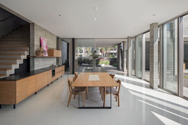 Hover House with rustic & brutal of concrete Design by Pranala Associates