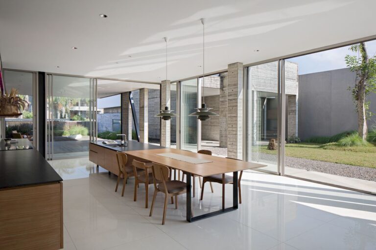 Hover House with rustic & brutal of concrete Design by Pranala Associates