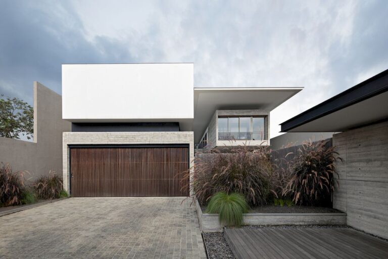 Hover House with rustic & brutal of concrete Design by Pranala Associates