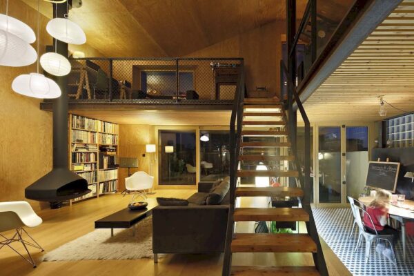 Landscape House features metal wall, sloping roof terrace by Mabire Reich