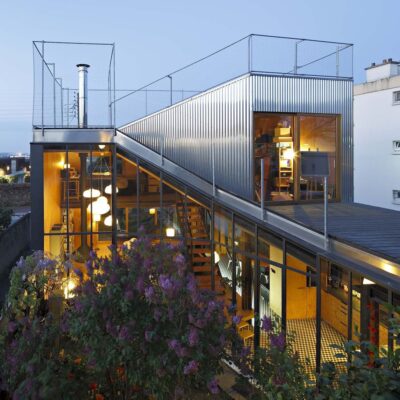 Landscape House features metal wall, sloping roof terrace by Mabire Reich