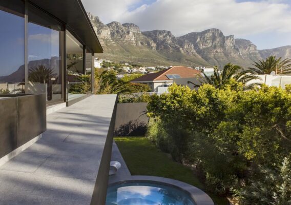 Cranberry Pavilion House prominent with its dark color by Wright Architects