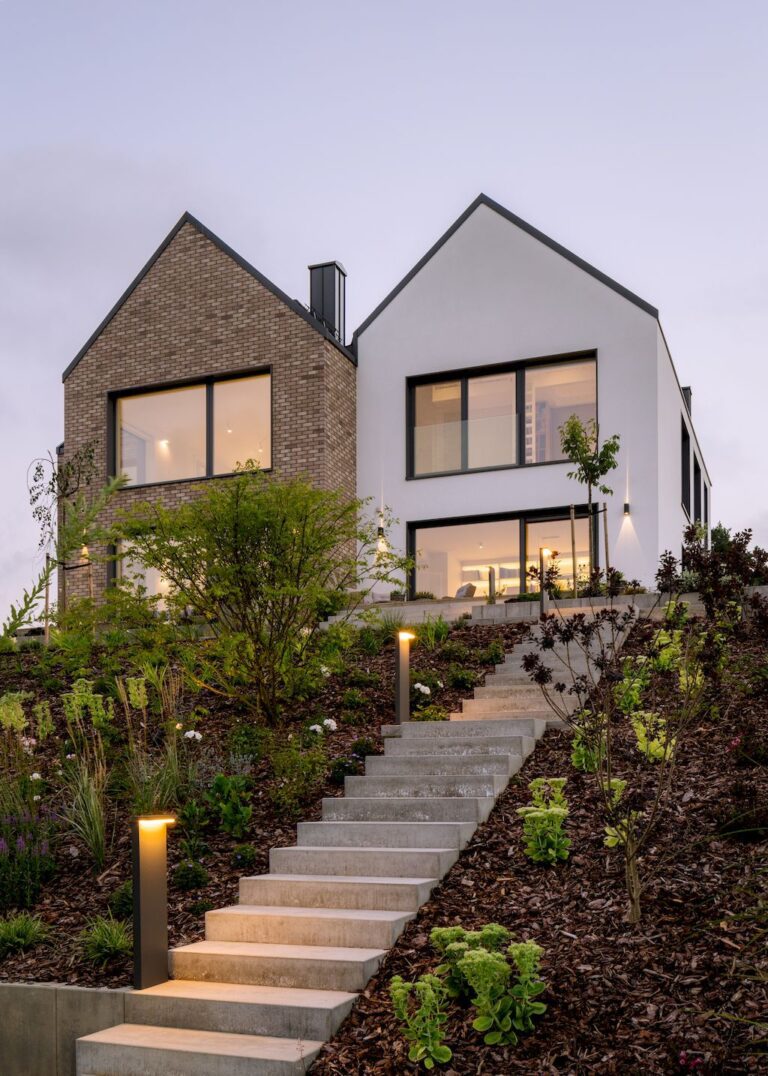 Multi Gable House with Picturesque Views of Forest in Brazil by bkm group