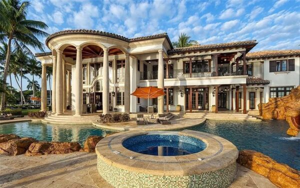 Palatial Palm Beac Inspired Mansion with 665 Feet of Wrap-Around Water ...